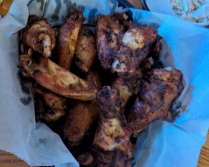Smoked wings that look like they've been kissed by the gods of fire and flavor. No dainty nibbling here—these demand joyful, messy commitment.