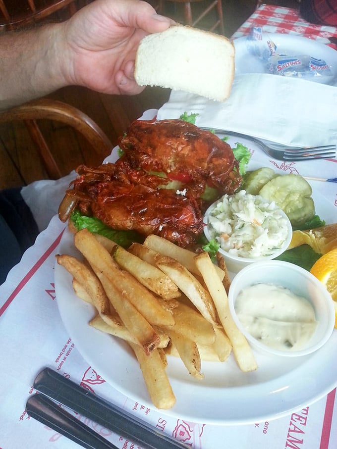 The soft shell crab sandwich—nature's perfect moment when a crab sheds its hard shell, quickly captured and transformed into crispy, tender bliss.