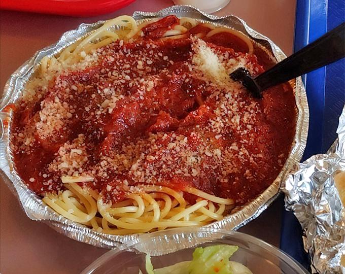 Spaghetti with meat sauce and a snowfall of Parmesan—comfort food that wraps around you like your grandmother's hug.
