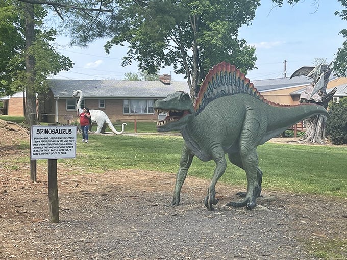 The Spinosaurus strikes an imposing pose with its sail-like back, looking ready for its close-up in a 1960s monster movie.