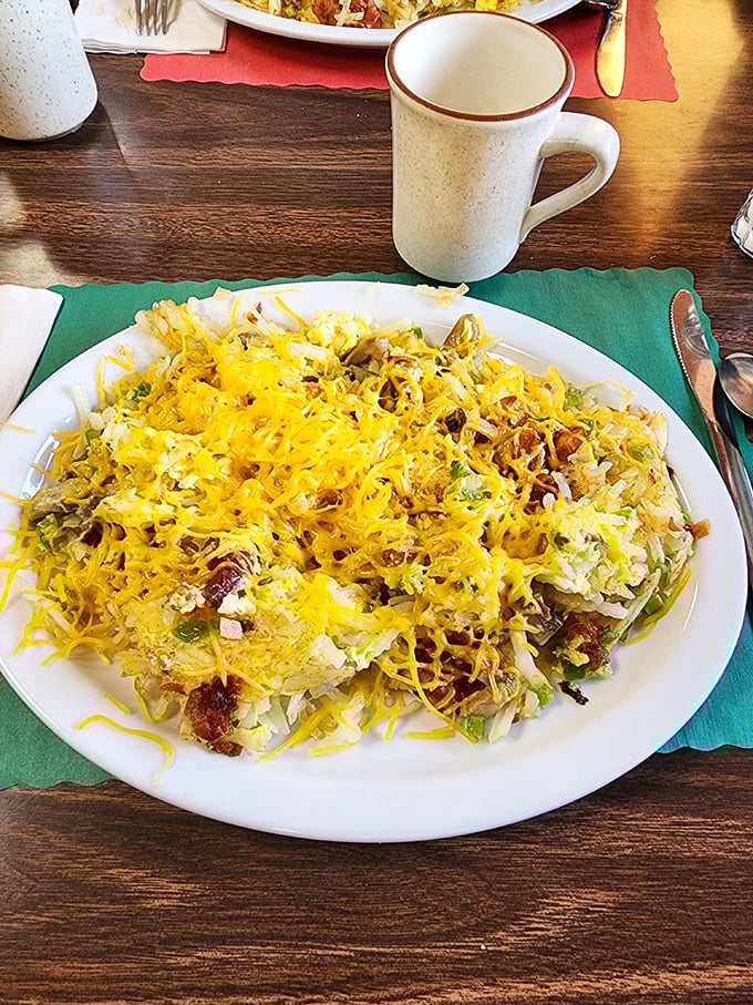 This mountain of hash browns, eggs, and melted cheese isn't just breakfast – it's edible architecture designed for maximum satisfaction.