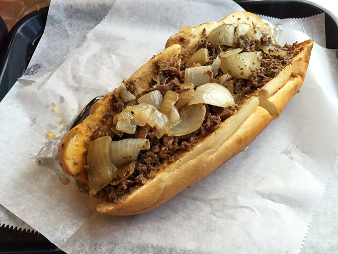 The classic steak sandwich with onions – no fancy garnishes needed when the fundamentals are executed with this level of respect and precision.