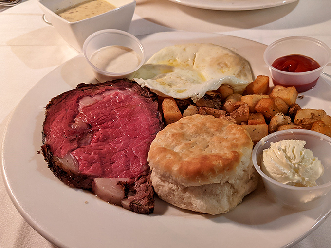 The Steak & Egg Platter proves that prime rib isn't just for dinner – especially when it shares the plate with a biscuit that could make angels weep.