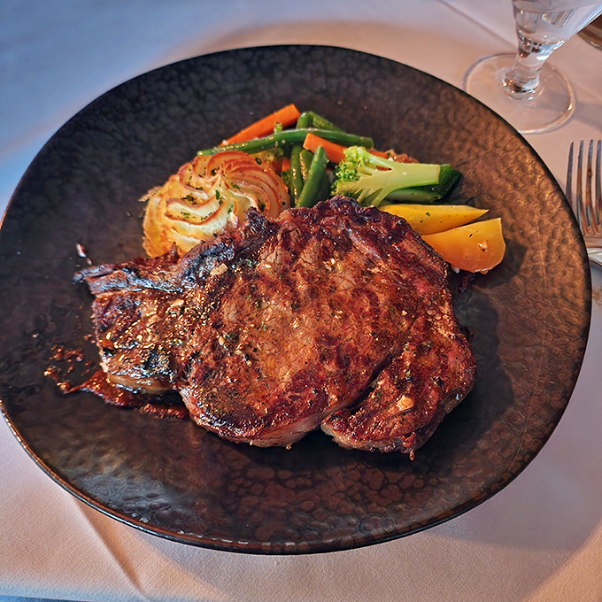 A perfectly seared steak that doesn't need fancy tricks—just fire, skill, and respect for the ingredient. The vegetables aren't afterthoughts either.