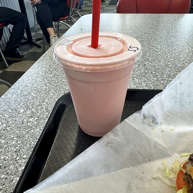 This strawberry shake isn't just pink—it's the blush of first love, the sunset over the Pacific, and childhood summers all in one sippable package.