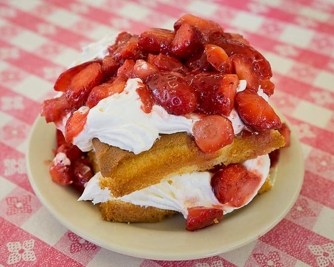 Not just strawberry shortcake—it's a towering monument to summer sweetness that makes you want to write thank-you notes to farmers.