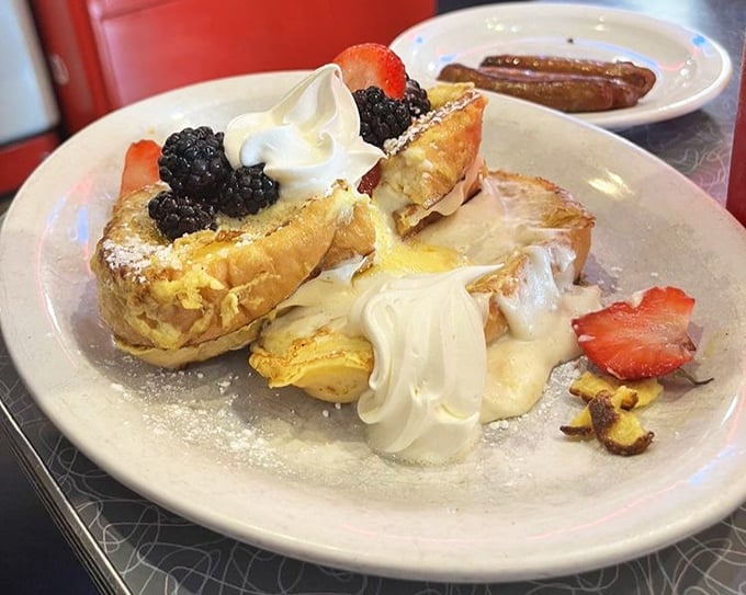 French toast stuffed with cream cheese filling and crowned with fresh berries – breakfast that thinks it's dessert, and nobody's complaining.