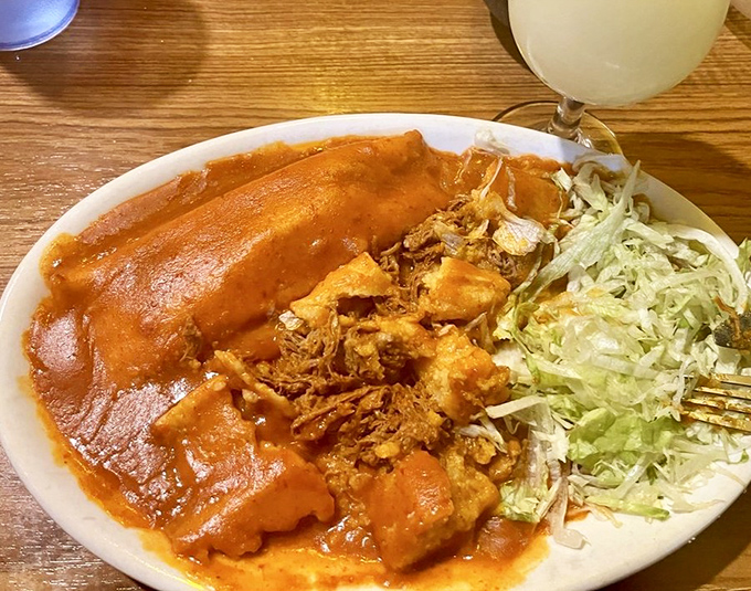 These tamales arrive like little presents wrapped in corn husks, hiding treasures of seasoned perfection inside.