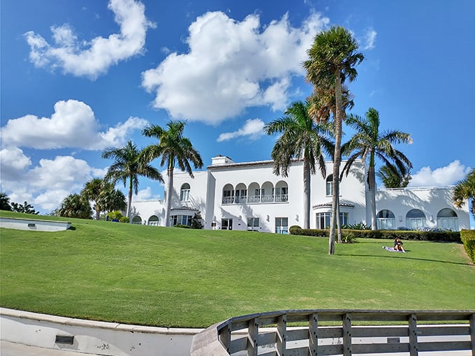 Old Florida grandeur that whispers tales of Gatsby-era soirées. The Mansion at Tuckahoe stands as a Mediterranean dream against tropical skies.