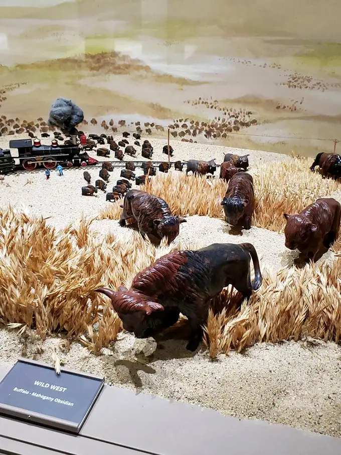 The Wild West comes alive in mahogany obsidian. These buffalo roaming through golden wheat fields prove that stone can tell stories better than some Hollywood westerns.