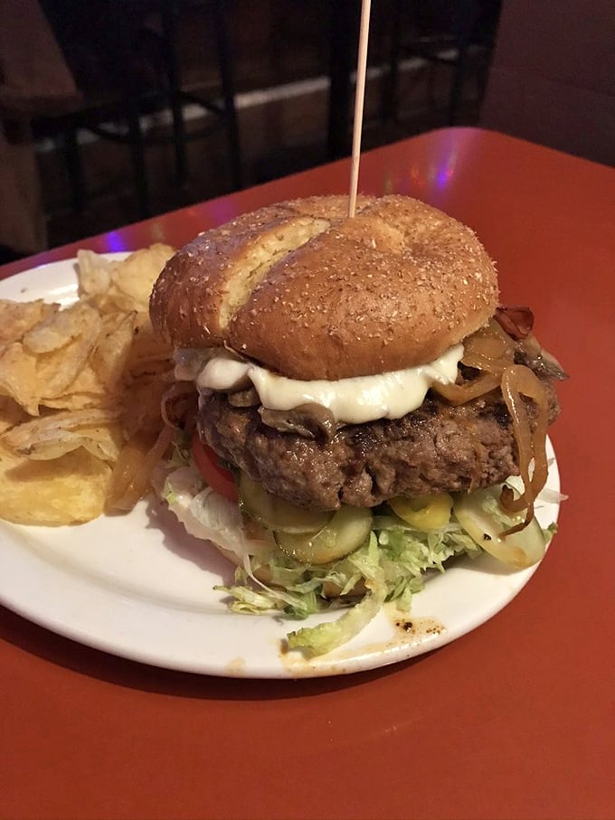 Behold the mythical Thurman burger in its natural habitat—a towering testament to the belief that "too much of a good thing" is just getting started.