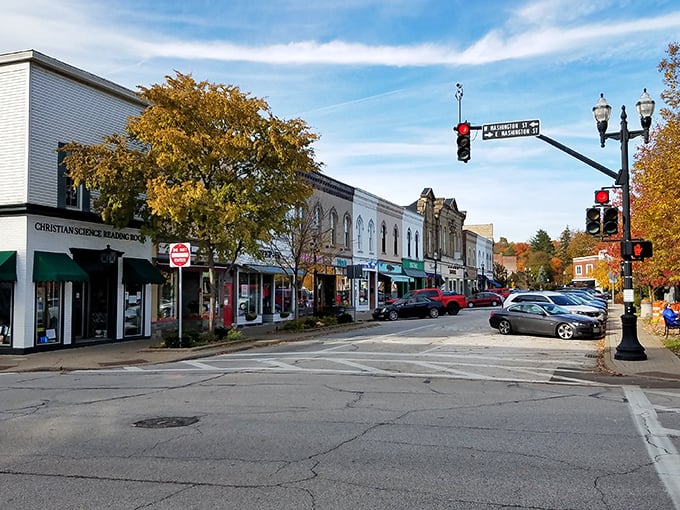 Fall foliage frames the historic storefronts like nature's own picture frame. Even the traffic lights seem to move at a more civilized pace.