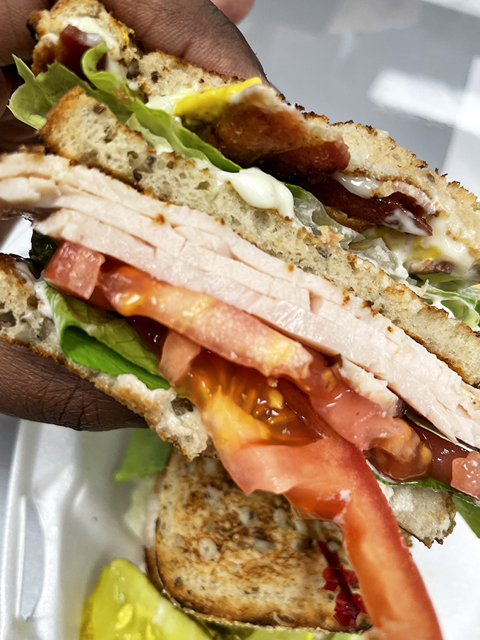 Layer upon glorious layer, this turkey club isn't just a sandwich—it's a skyscraper of flavor that requires strategic eating techniques.