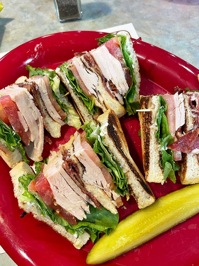 Turkey club perfection: where crispy bacon meets fresh lettuce in a symphony of satisfying flavors.