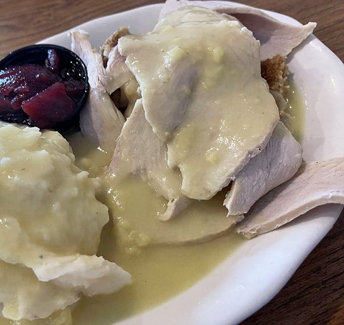 Thanksgiving on a plate doesn't need a holiday—tender turkey swimming in gravy with mashed potatoes playing the perfect supporting role.