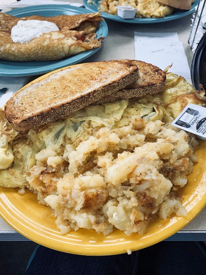 A perfect omelet alongside those famous lyonnaise potatoes – proof that breakfast potatoes can indeed be life-changing.