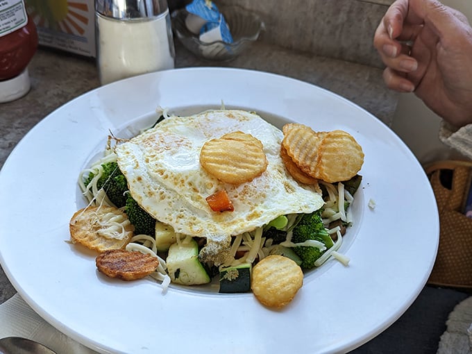 Vegetables trying to convince you they're health food while hiding under a perfectly fried egg—the ultimate breakfast disguise.