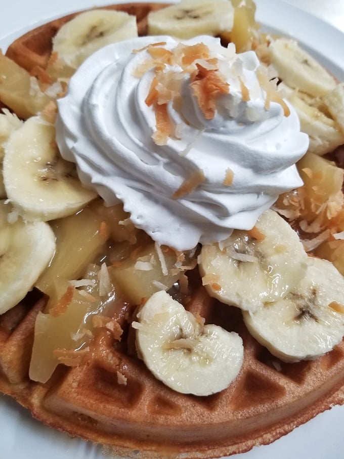 This isn't just a waffle with bananas and whipped cream—it's what clouds would taste like if they were made by someone who really loves you.