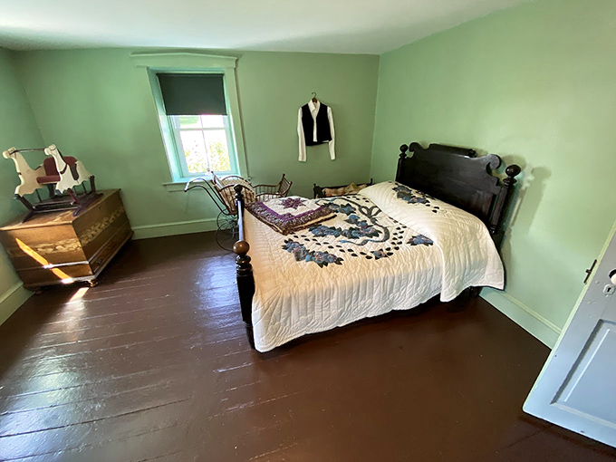 Minimalist bedroom design that Marie Kondo would approve—every item has purpose, function, and that handcrafted quilt definitely sparks joy.