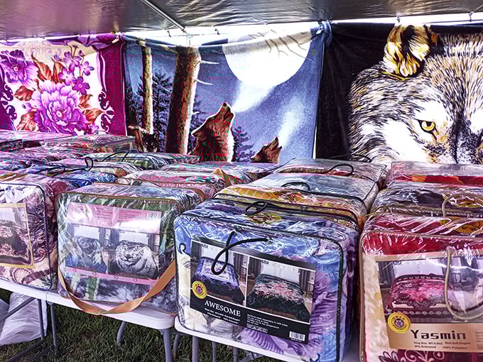 Wolf blankets howl for attention among floral bedspreads. In Michigan winters, these aren't just decorative—they're survival gear with personality.