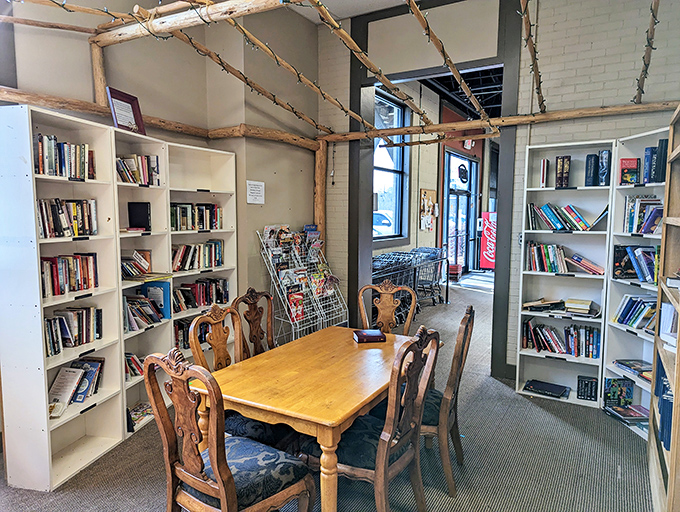 The literary nook creates a cozy retreat with rustic branch accents, where bibliophiles can discover forgotten classics and recent bestsellers alike.