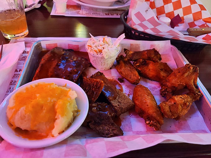 The holy trinity of BBQ perfection—ribs, chicken, and sides that know their supporting role but still manage to steal scenes like a young Meryl Streep.