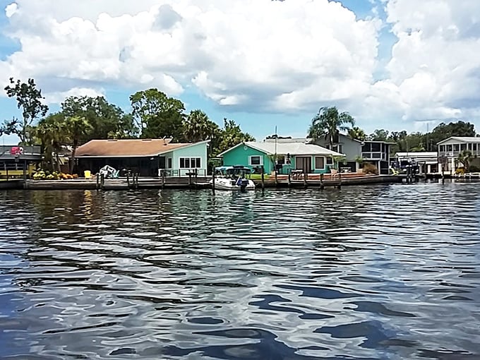 Colorful waterfront cottages line the Homosassa River like a box of saltwater taffy—sweet, nostalgic, and quintessentially coastal Florida.