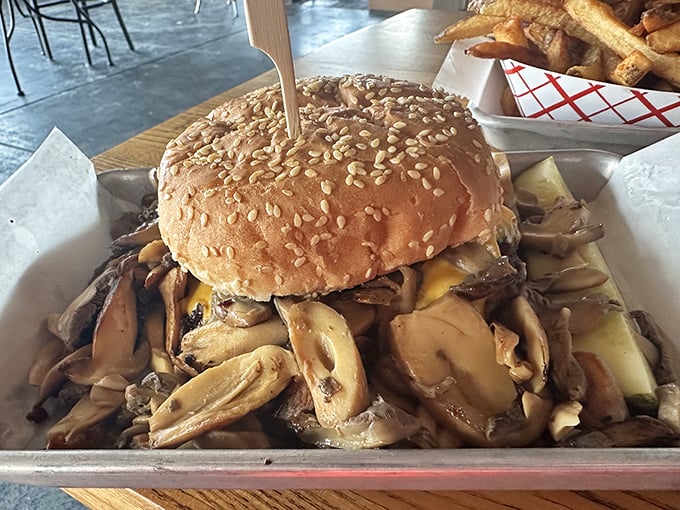 This isn't just a mushroom burger—it's a structural marvel of fungal engineering that demands respect, a napkin, and possibly a moment of silence.