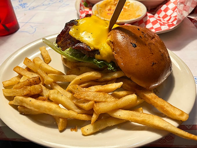 Behold the cheeseburger in its natural habitat—a thing of simple beauty that requires no filter, just extra napkins and possibly a nap afterward.