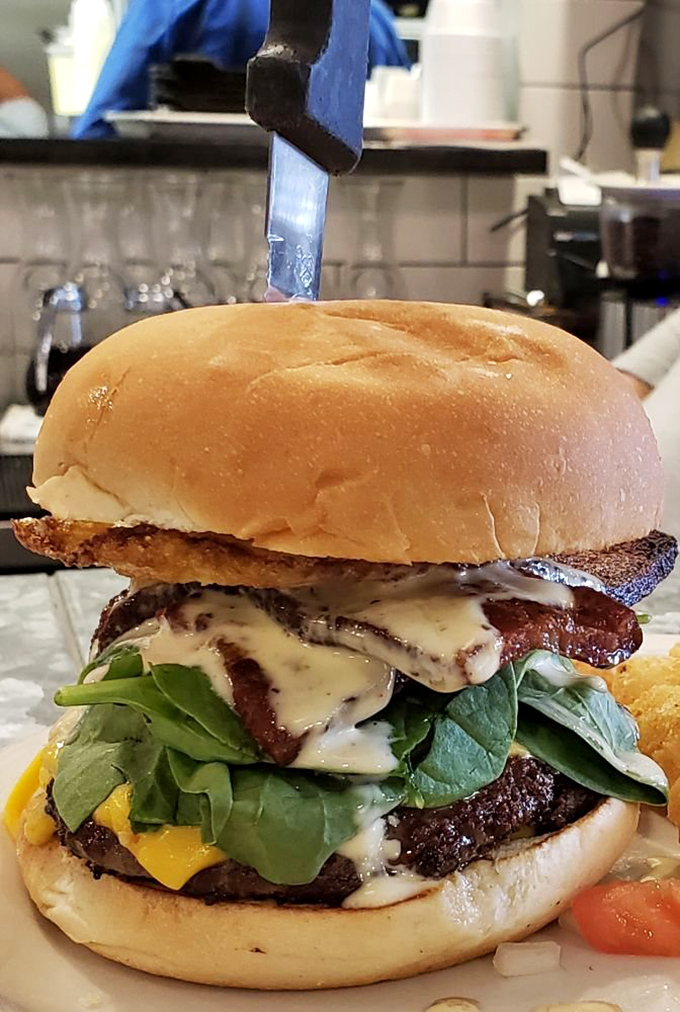Not just another burger – this is architecture in food form. The melty cheese cascading down like a dairy waterfall deserves its own sonnet.