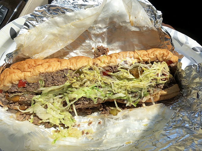 Behold the cheesesteak hoagie—Philly's answer to "Why choose between two perfect things?" The shredded lettuce adds that crucial textural counterpoint.