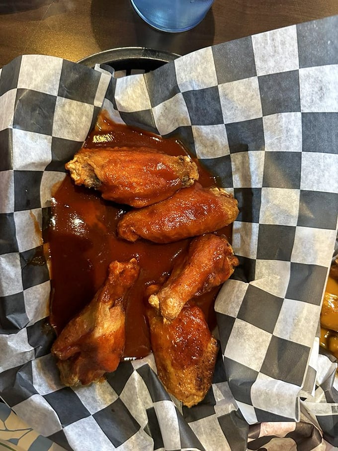 These sauce-slathered wings aren't just finger-licking good—they're the kind you'll be thinking about during important meetings three days later.