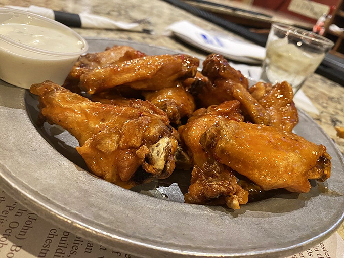 These wings aren't trying to reinvent the wheel—they're just perfecting it with a golden-brown crispiness that makes your fingers sticky and your soul happy.