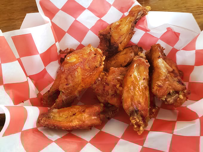 Wings that have clearly been introduced to heat in all the right ways—crispy, seasoned, and ready to make your fingers gloriously messy.