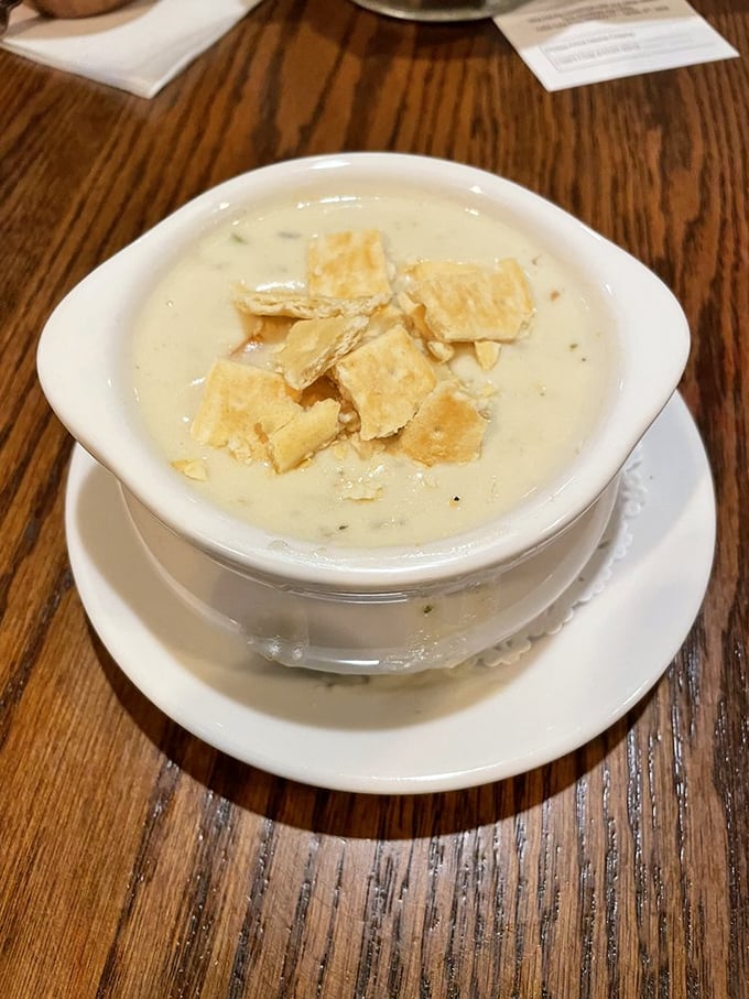 New England clam chowder topped with oyster crackers—the kind that makes you wonder if they've secretly installed a pipeline directly from Cape Cod.