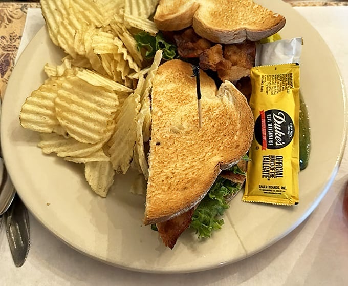 A sandwich that understands proper architecture. Layers of goodness between perfectly toasted bread—the structural integrity alone deserves an engineering award.