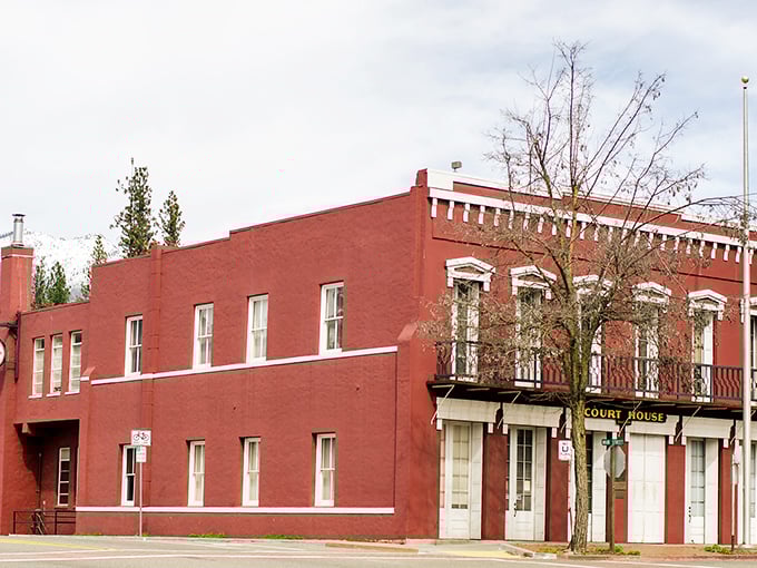 The historic courthouse stands proudly in its brick-red glory, silently witnessing generations of Weaverville stories – if only walls could publish memoirs.