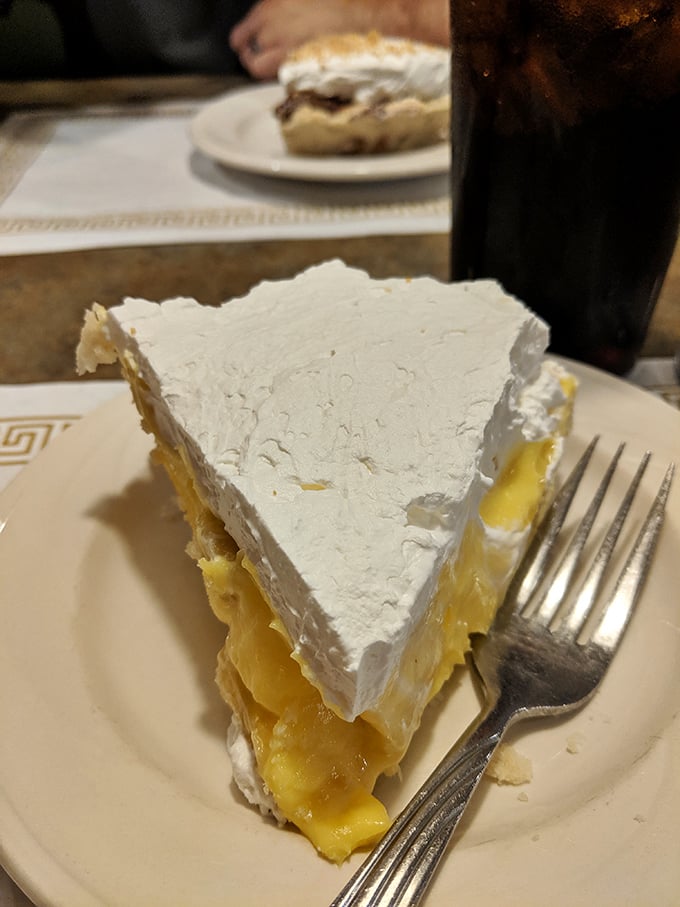 Behold the cream pie with meringue so tall it needs its own zip code. This is what clouds wish they tasted like.