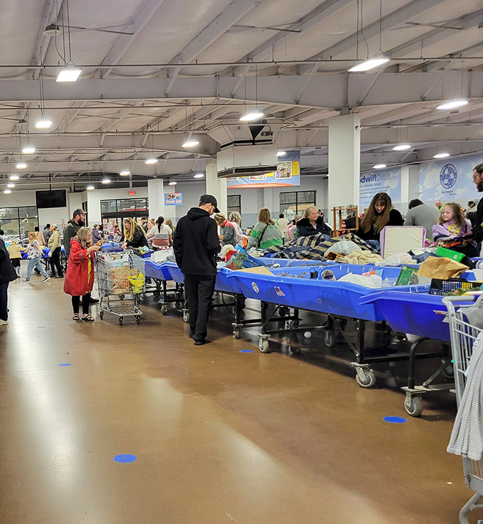 The "fresh bin rush" in action—shoppers strategically positioned like chess players, ready to make their moves when new merchandise arrives.