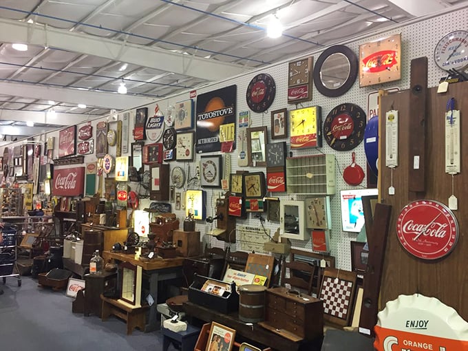 The wall of vintage advertising celebrates a time when Coca-Cola cost a nickel and logos were works of art.