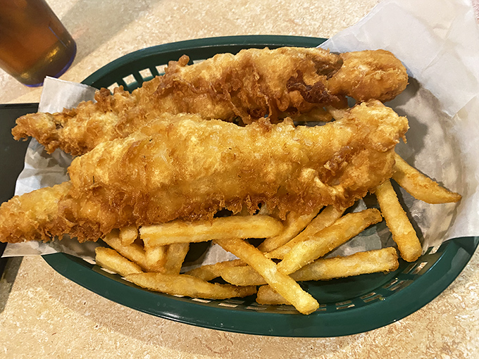 Golden-battered fish that shatters at first bite, paired with fries that could make a Brit homesick—this is comfort food elevated to an art form.