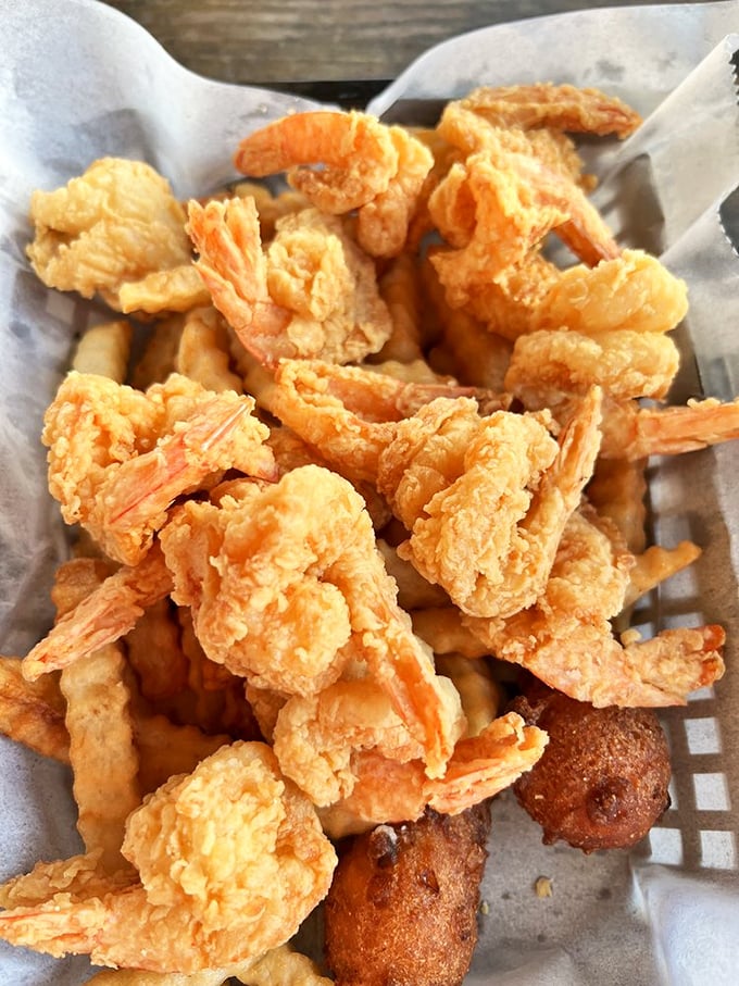 Fried shrimp and hush puppies – a basket of Gulf goodness where each golden morsel delivers that perfect crunch-to-sweetness ratio.