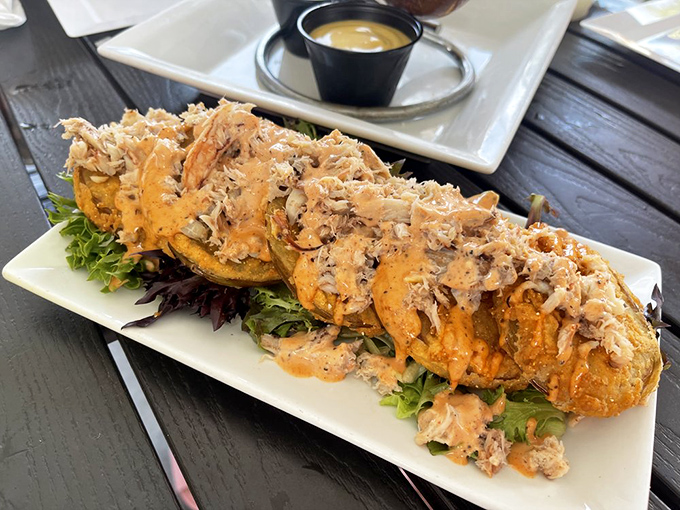Crab-topped fried tomatoes that somehow manage to be both indulgent and elegant—the culinary equivalent of wearing diamonds to the beach.