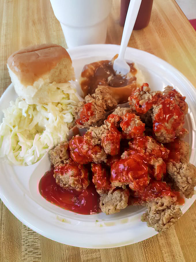 Coleslaw providing the perfect cool counterpoint to hot, sauce-drenched chicken. A harmony of flavors that sings in your mouth.