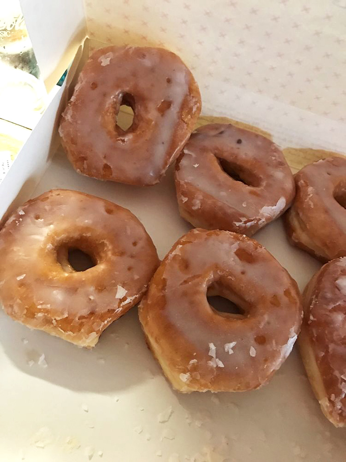 Glazed donuts so perfect they practically glow – like halos for your taste buds and your soul.