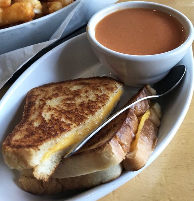 The humble grilled cheese and tomato soup—childhood comfort elevated to an art form that would make both grandma and Gordon Ramsay nod approvingly.