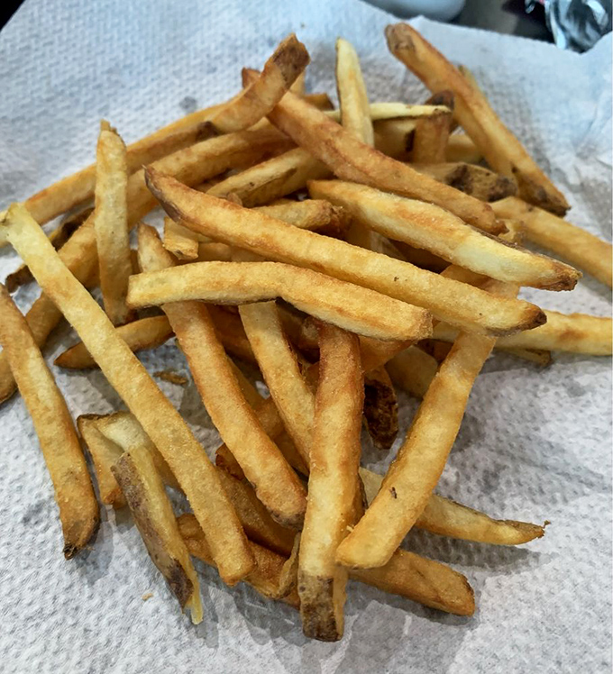 These aren't those sad, frozen afterthoughts that some places serve. These fries actually remember they came from a potato.