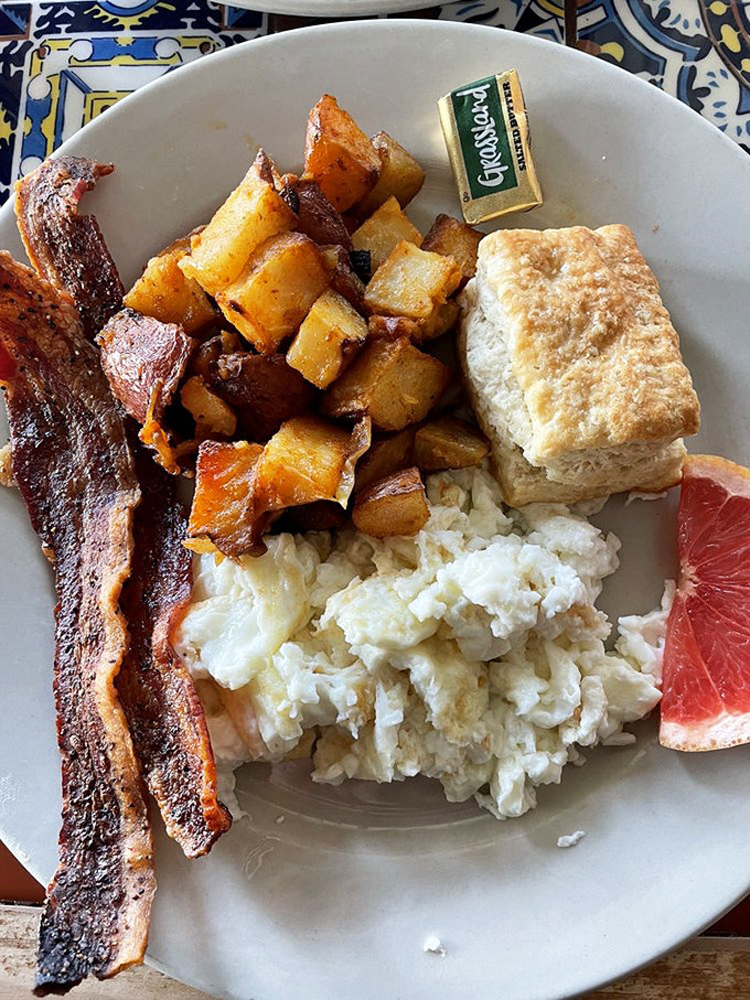 Home fries done right alongside crispy bacon prove that simple ingredients create the most memorable mornings.