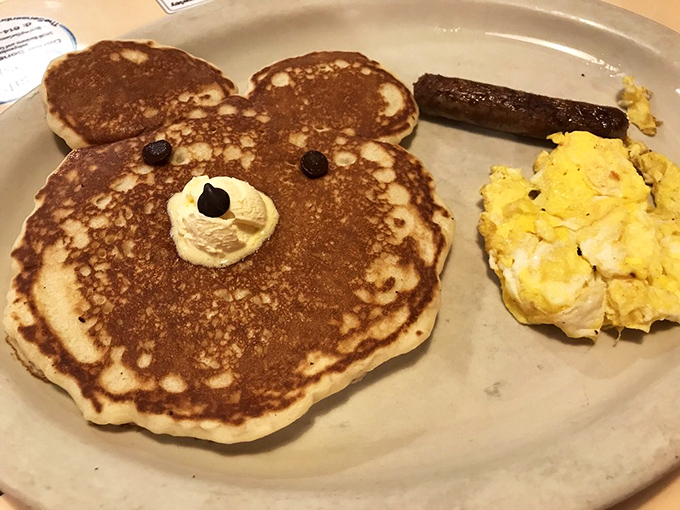 Behold the bear pancake—where breakfast becomes art. Those chocolate chip eyes are judging your decision not to order bacon.