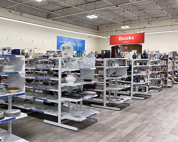 Treasure hunting central, where the "Books" sign beckons bibliophiles while glassware gleams under fluorescent lights – retail archaeology at its finest.
